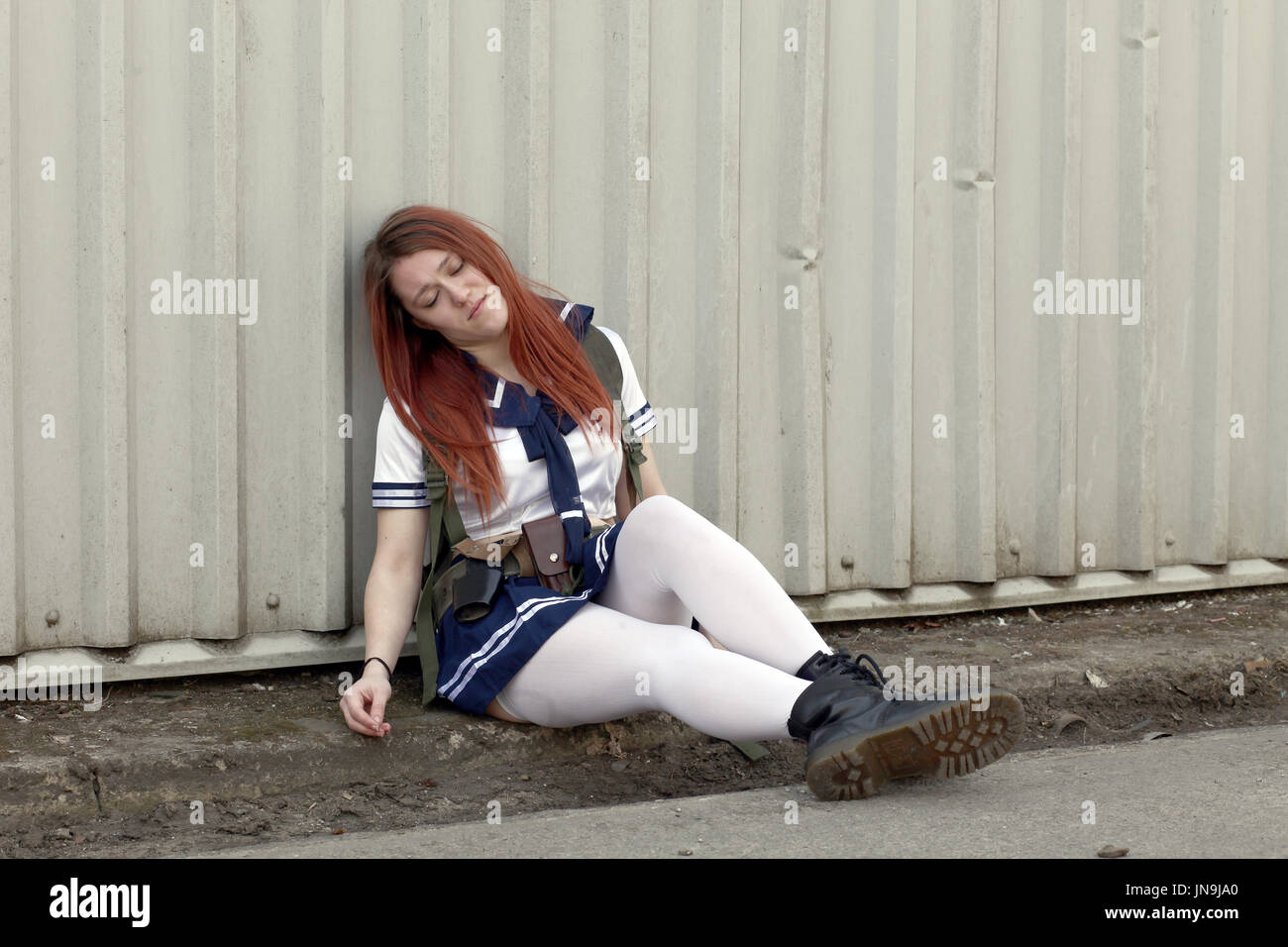 Young woman in a cosplay costume acting around and posing Stock Photo ...