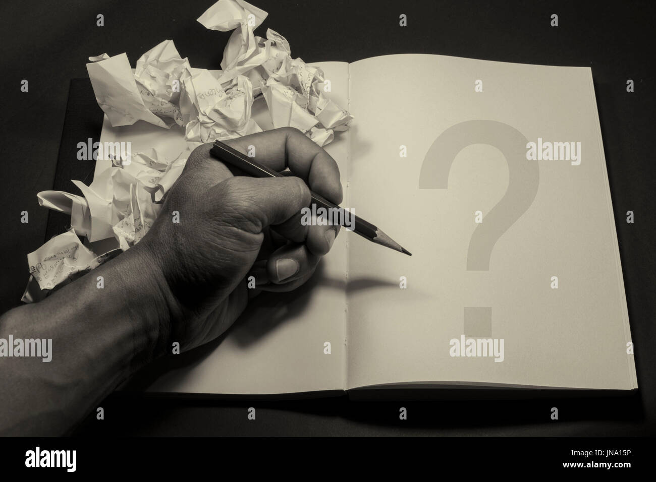 Question mark on notebook page Stock Photo - Alamy