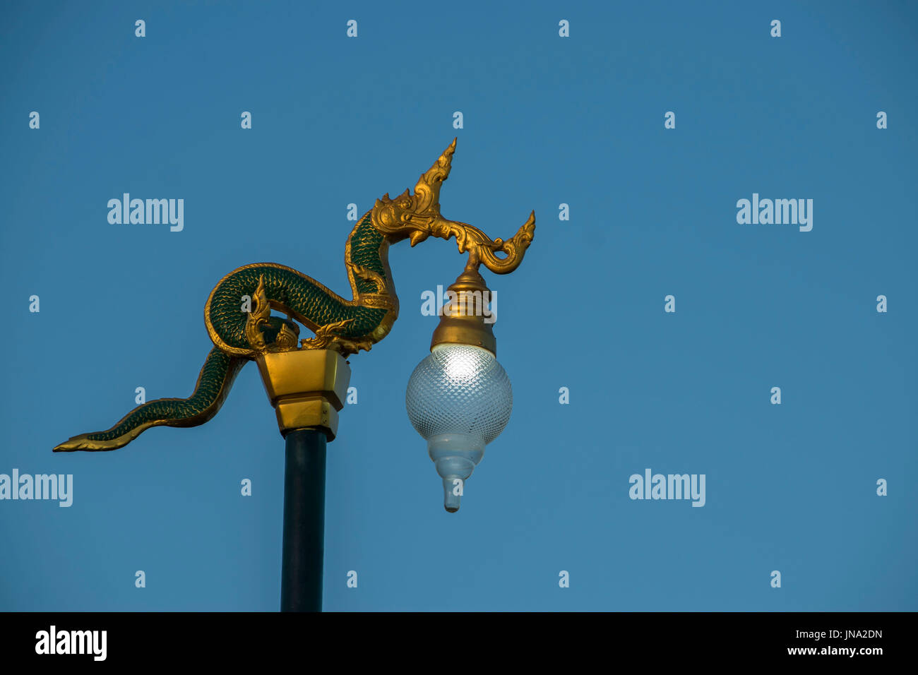 Golden Naga Thai traditional street lamp.The king of snake lamppost ...