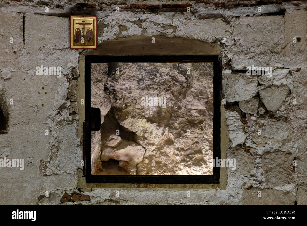 Glass covers the cracked Rock of Calvary which according to earliest ...