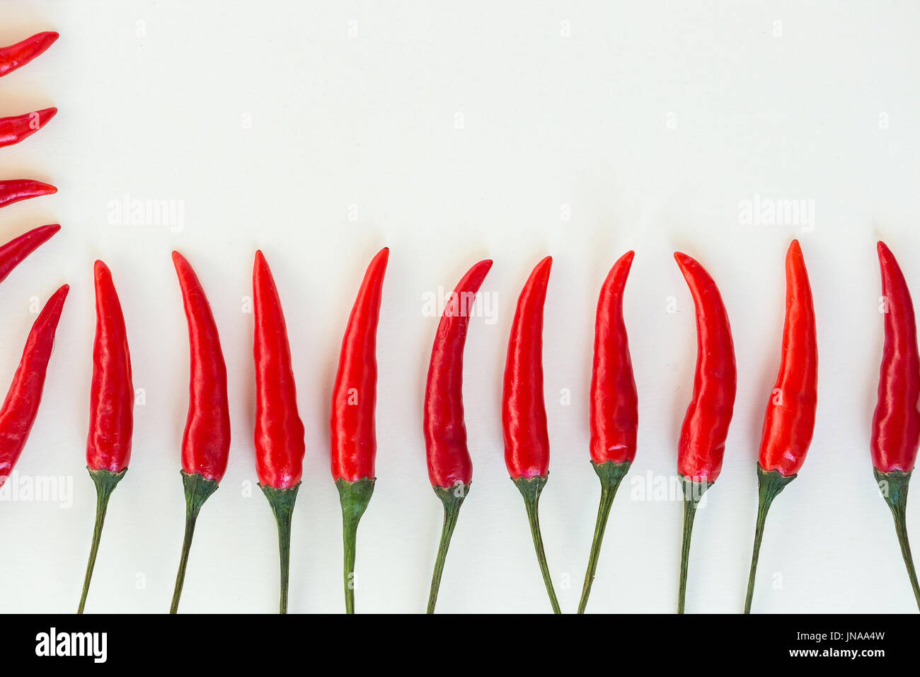 red hot chili peppers, popular spices concept - vertically stacked row ...