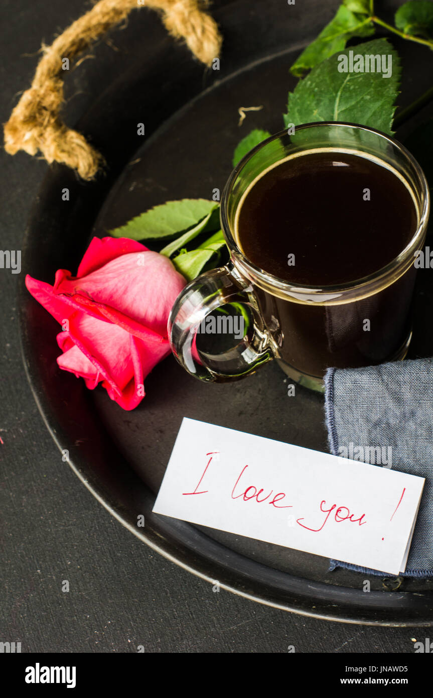 cup of coffee and red rose on the rustic background Stock Photo - Alamy