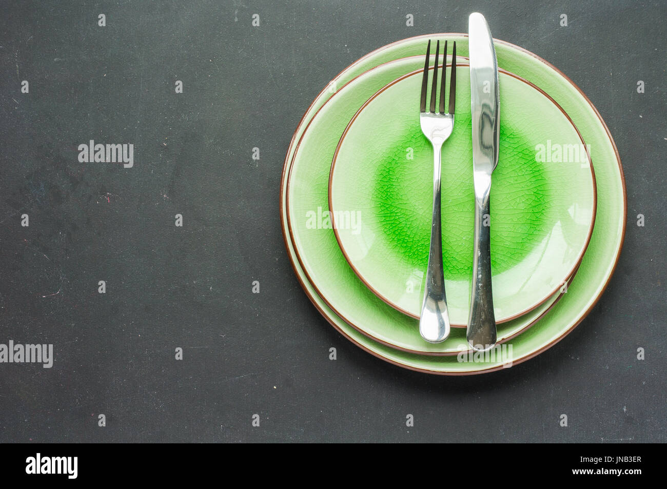 Rustic table setting with rosemary on dark wooden table with copyspace ...
