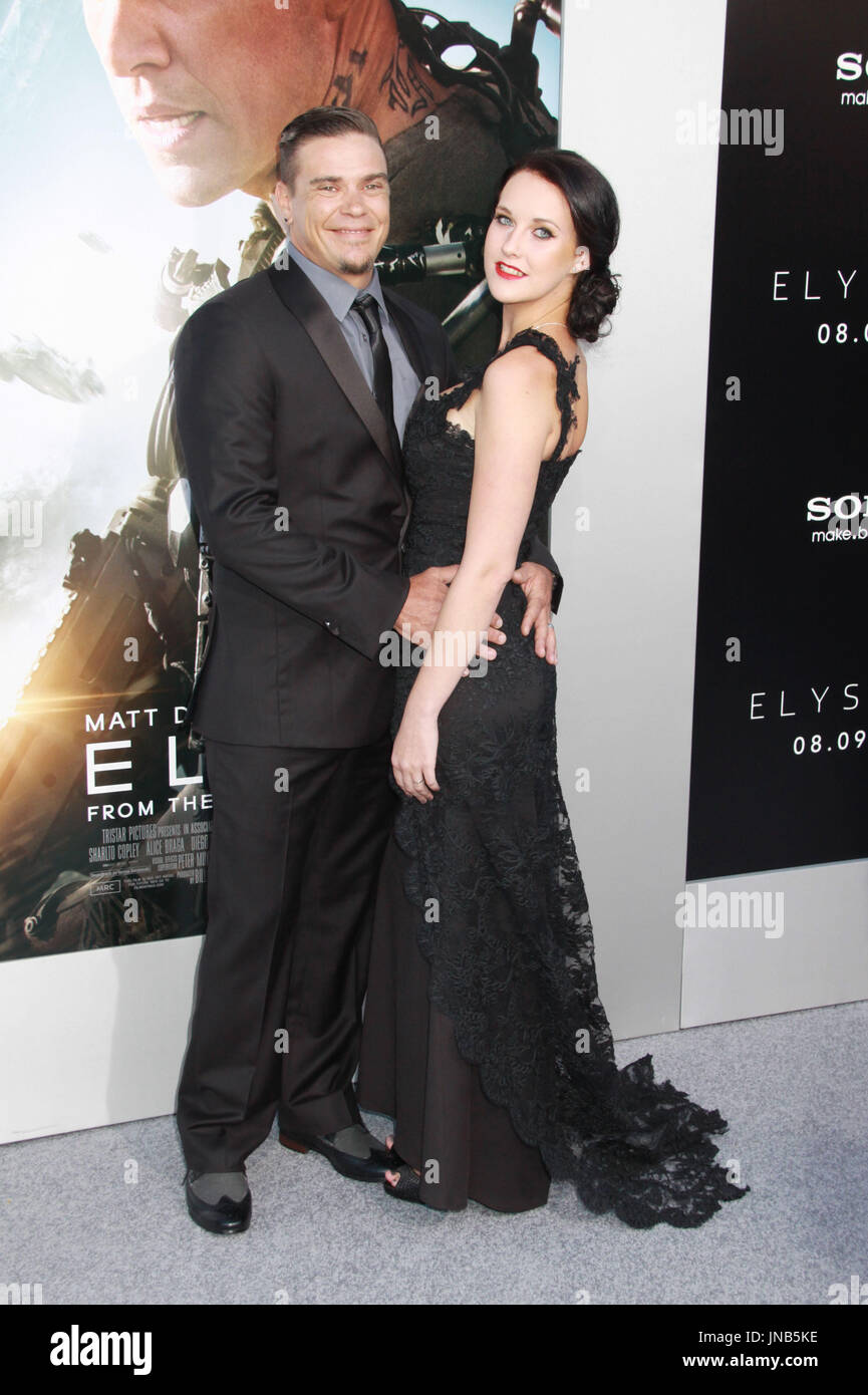 Brandon Auret, his wife 08/07/2013 "Elysium" Premiere held at Regency ...