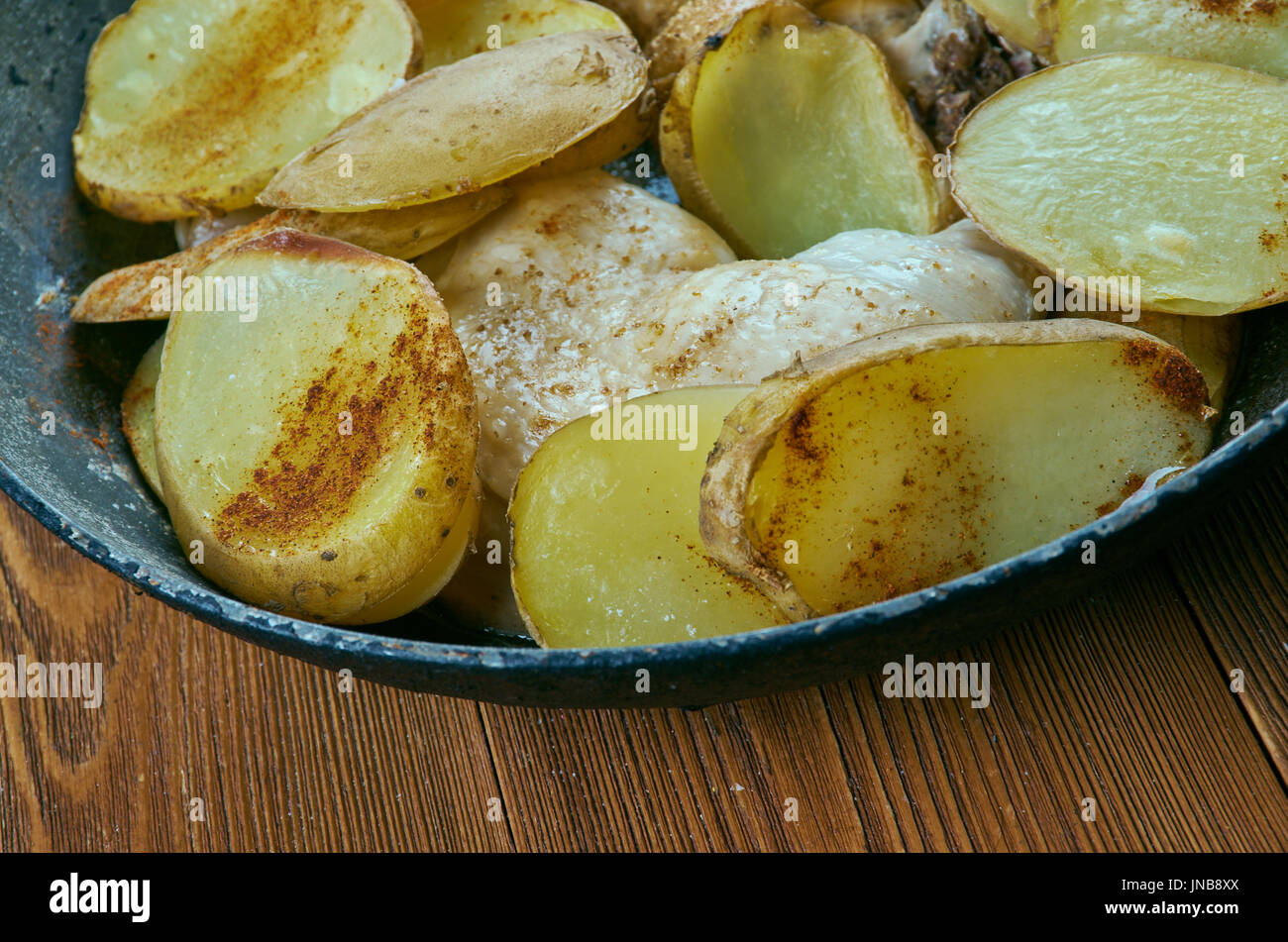 Roasted Duck Legs and Potatoes a frying pan - Duck confit Stock Photo ...
