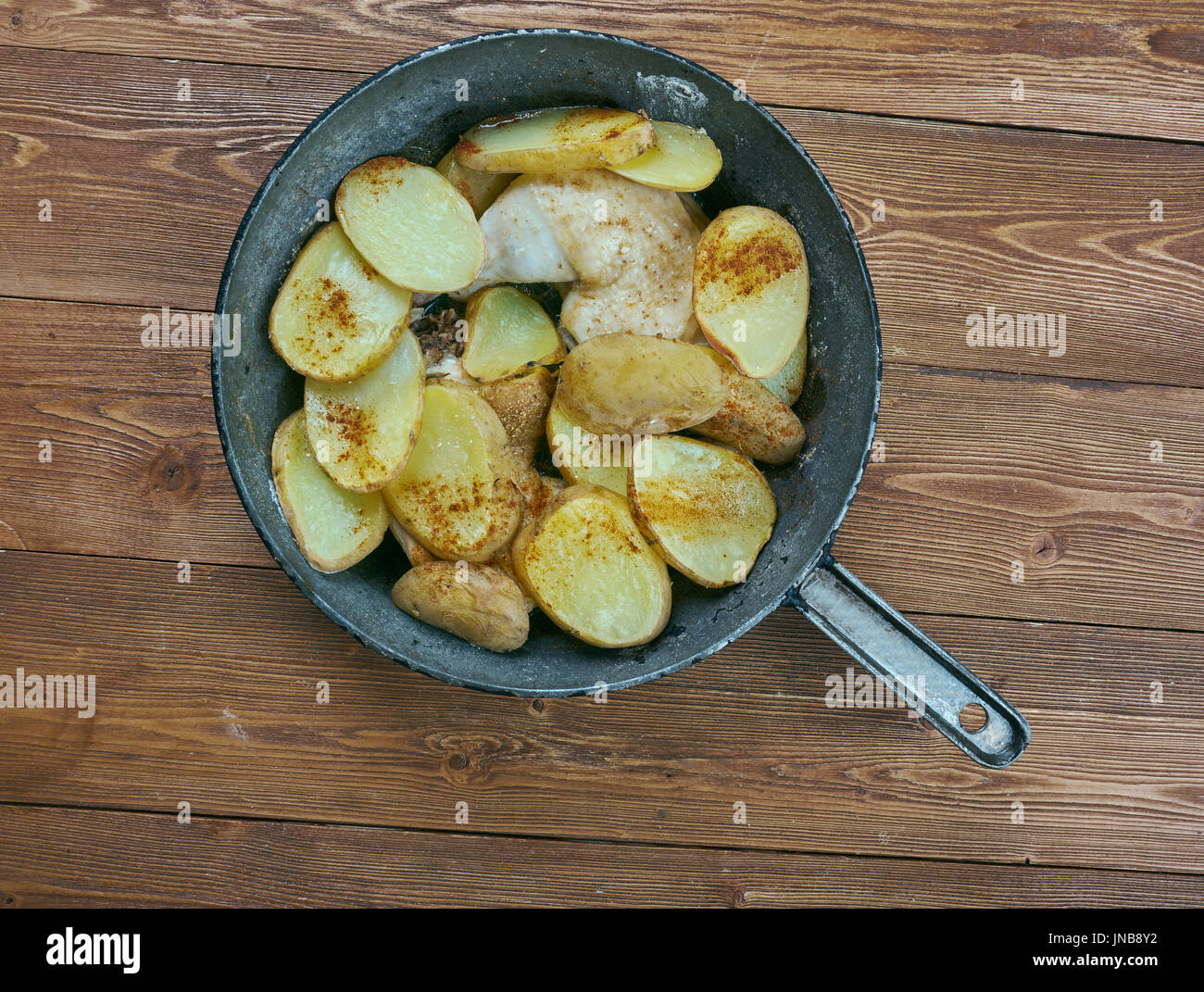 Roasted Duck Legs and Potatoes a frying pan - Duck confit Stock Photo ...