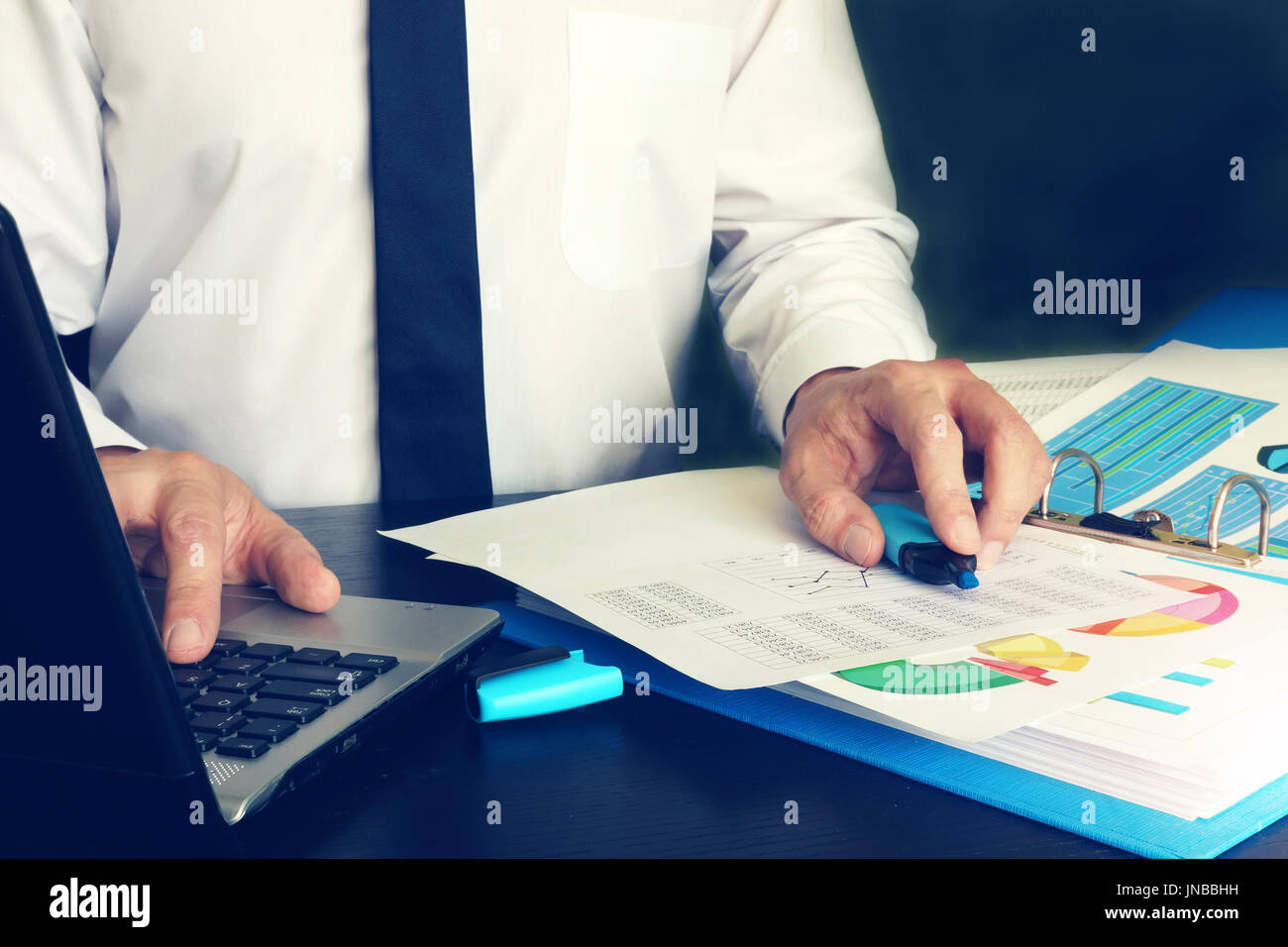 Working day of manager with laptop in office Stock Photo - Alamy