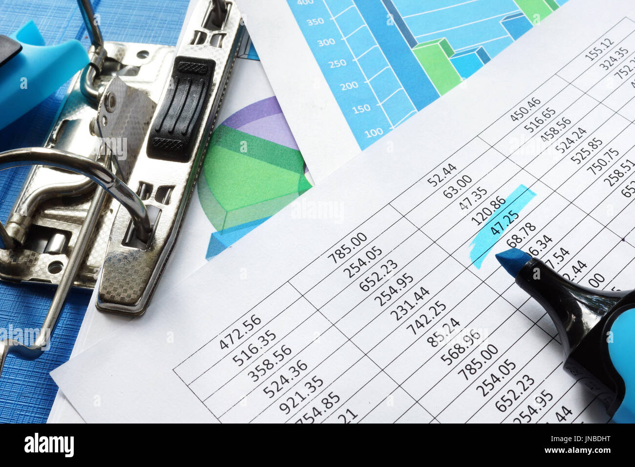 Accounting concept. Financial statements in a folder Stock Photo - Alamy
