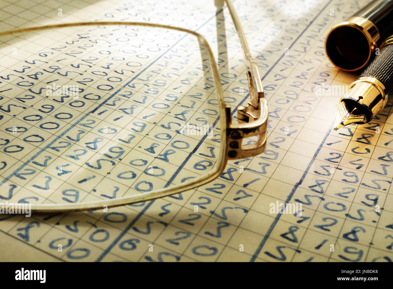 Audit trail. Glasses, pen and accounting ledger. Selective focus Stock ...