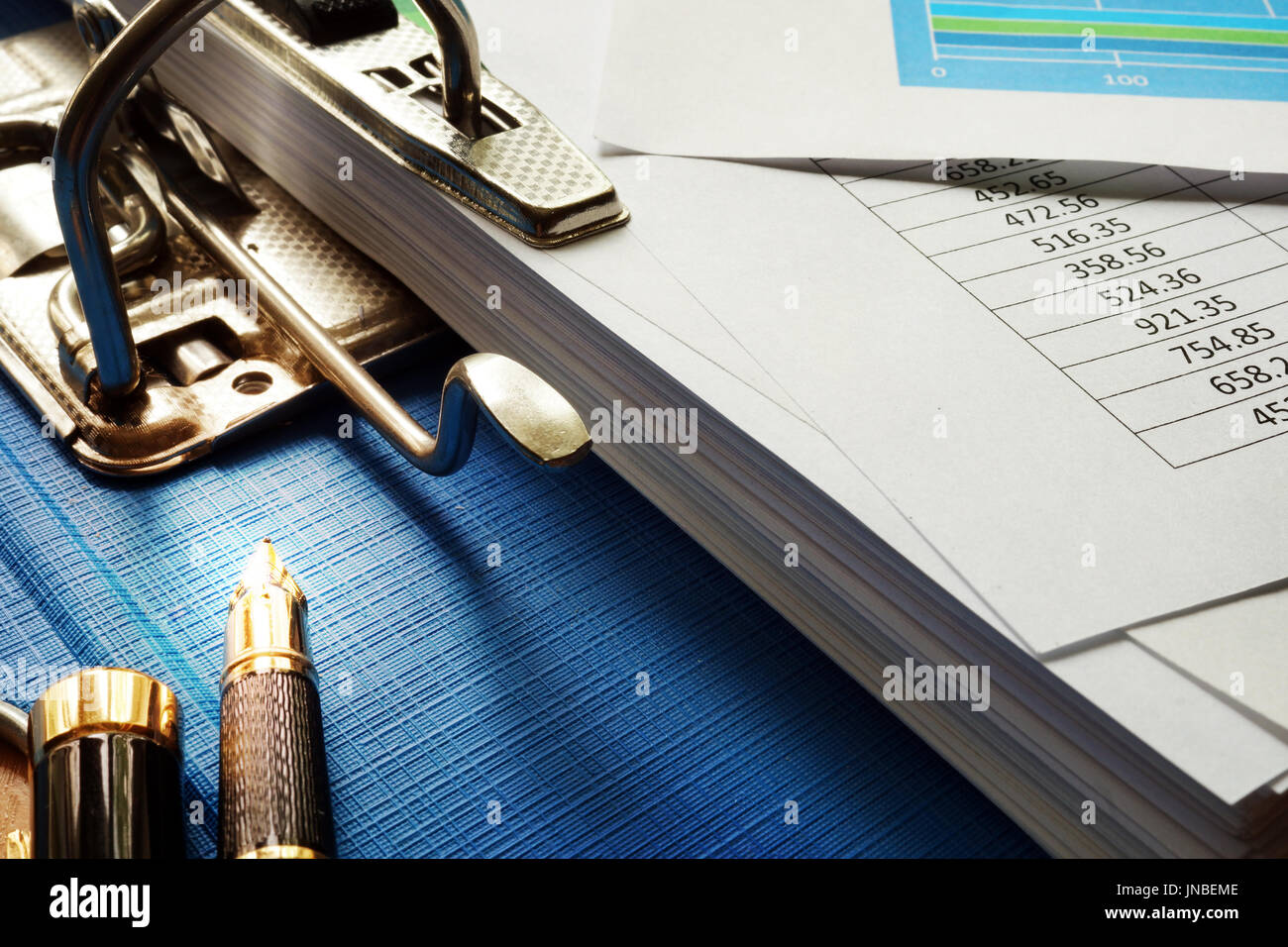 Stack of financial documents on an office desk Stock Photo - Alamy