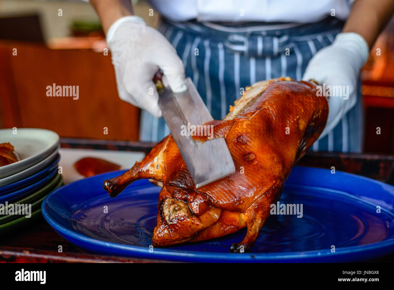 Chinese Chef chopping serving Peking duck Stock Photo - Alamy
