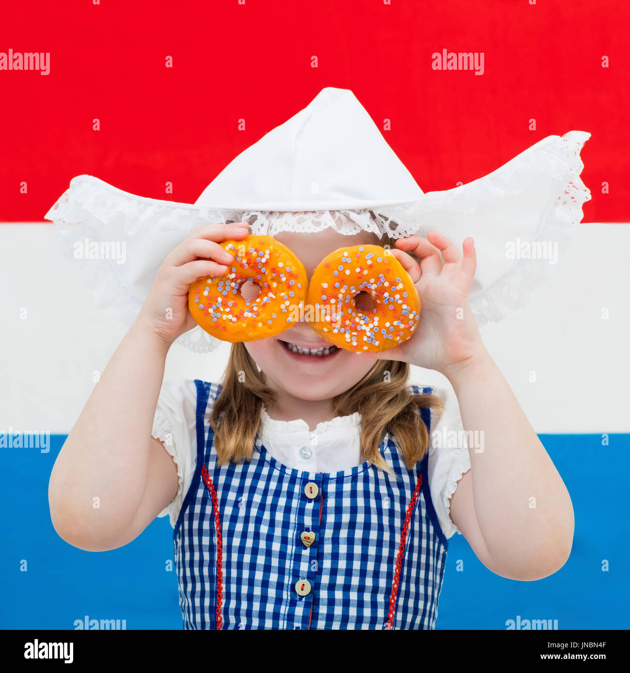 Little Dutch girl wearing traditional national costume, dress and hat ...