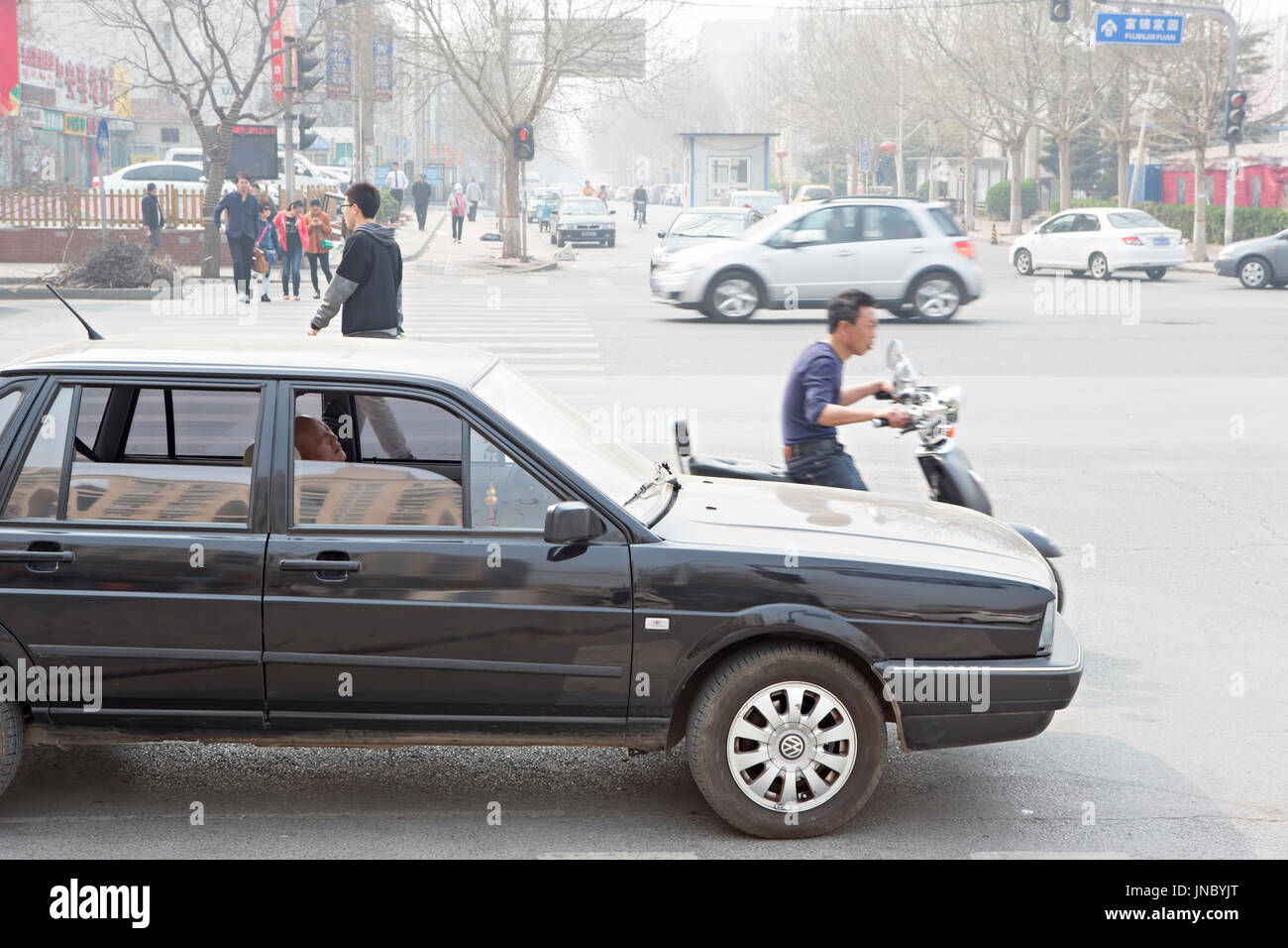Chinese driver asleep behind the wheel on busy road, Beijing, China ...