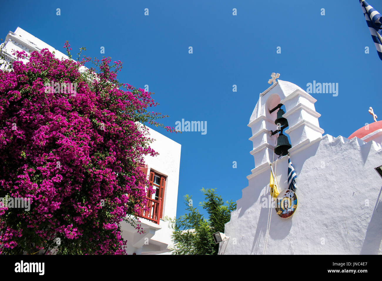 Blue sky and flowers in greece Stock Photo - Alamy