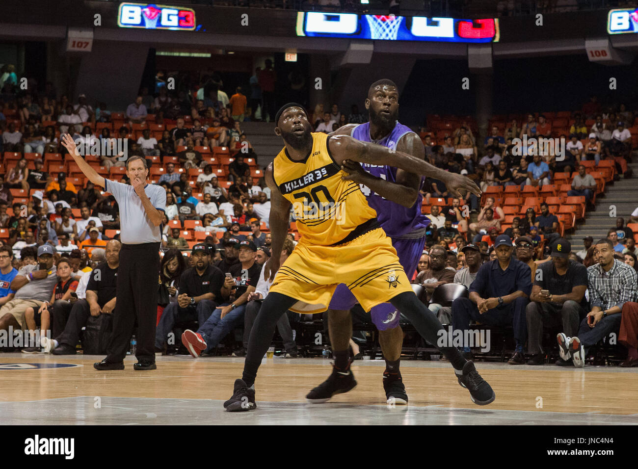 Reggie Evans #30 Killer 3s Ivan Johnson #44 Ghost Ballers guard each ...