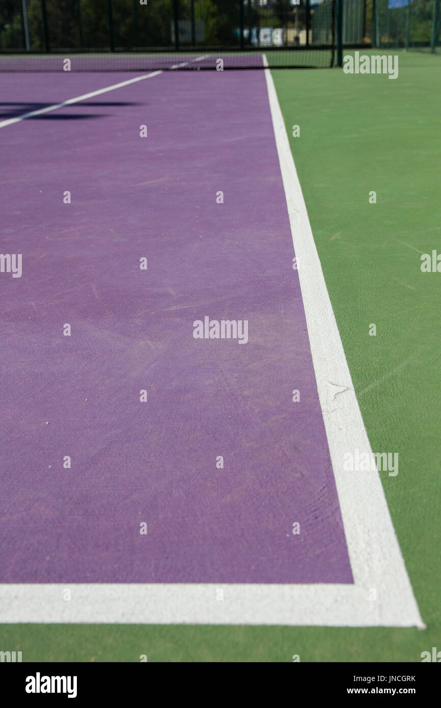 Lines of the corners of a cement tennis court. Track colors are purple ...