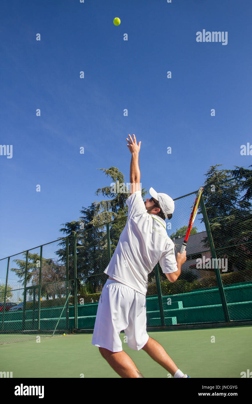 Professional tennis player is doing a kick tennis on a tennis court on ...