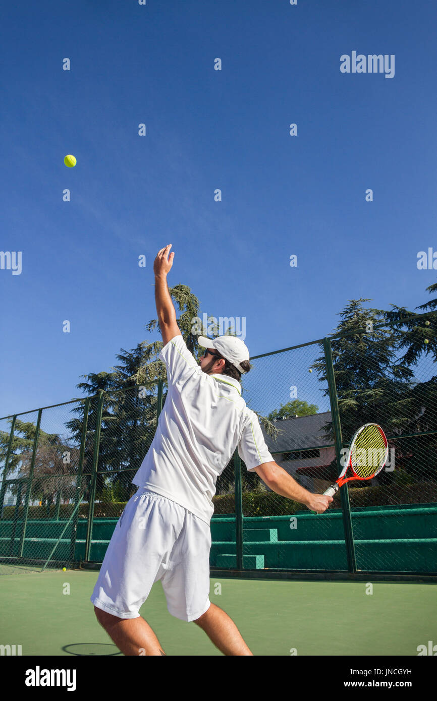 Professional tennis player is doing a kick tennis on a tennis court on ...