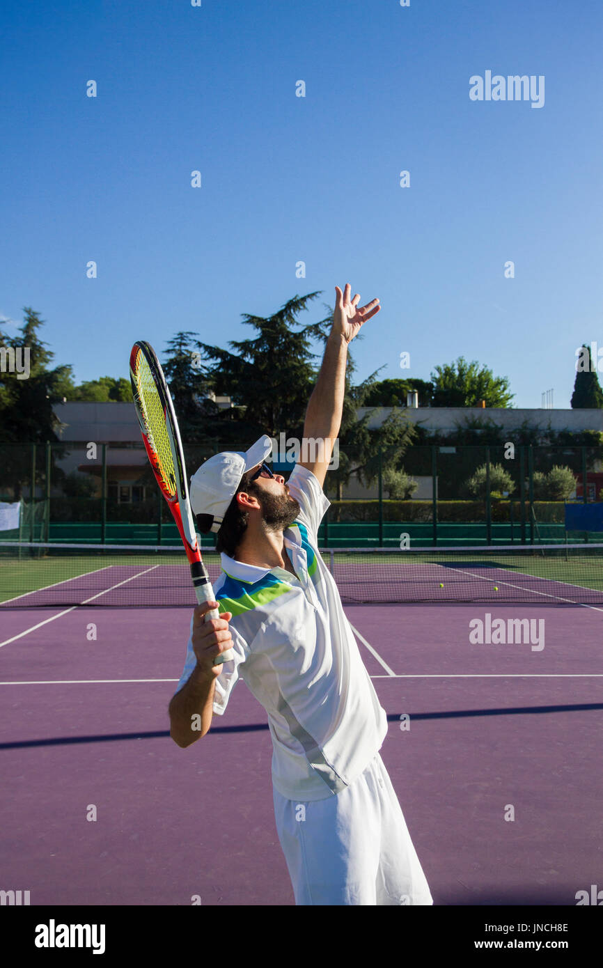 Professional tennis player is doing a kick tennis on a tennis court on ...