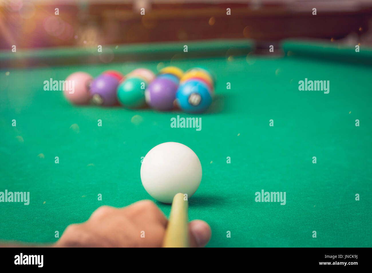 Man playing billiards in a pool table Stock Photo - Alamy