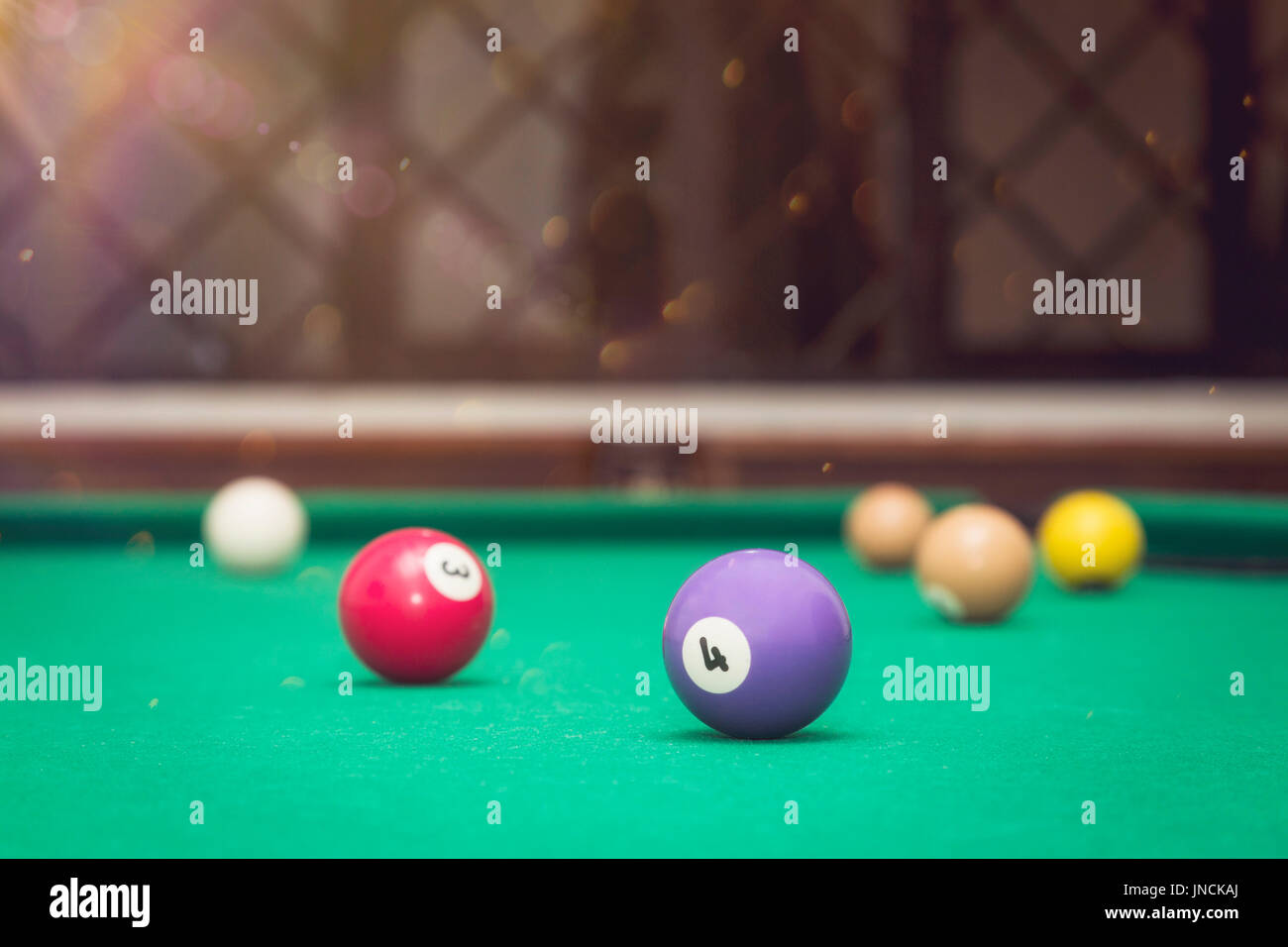 Billiard Balls in a pool table Stock Photo - Alamy