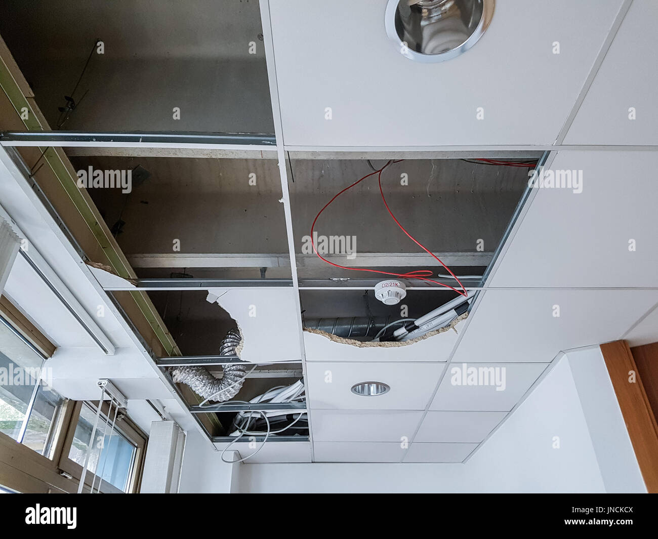 Ceiling panels damaged and collapsed by water Stock Photo - Alamy
