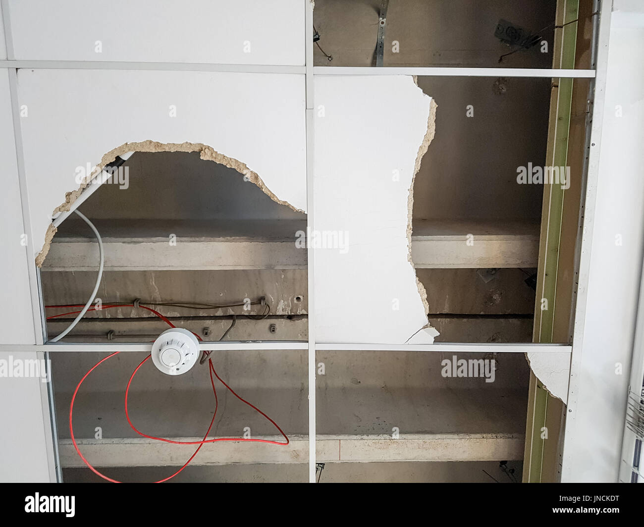Ceiling panels damaged and collapsed by water Stock Photo - Alamy