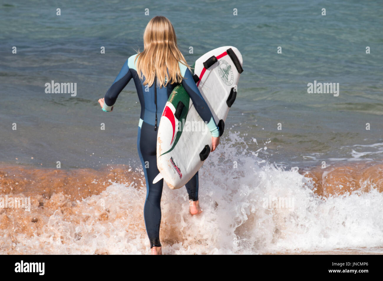 Girls surf board hi-res stock photography and images - Alamy