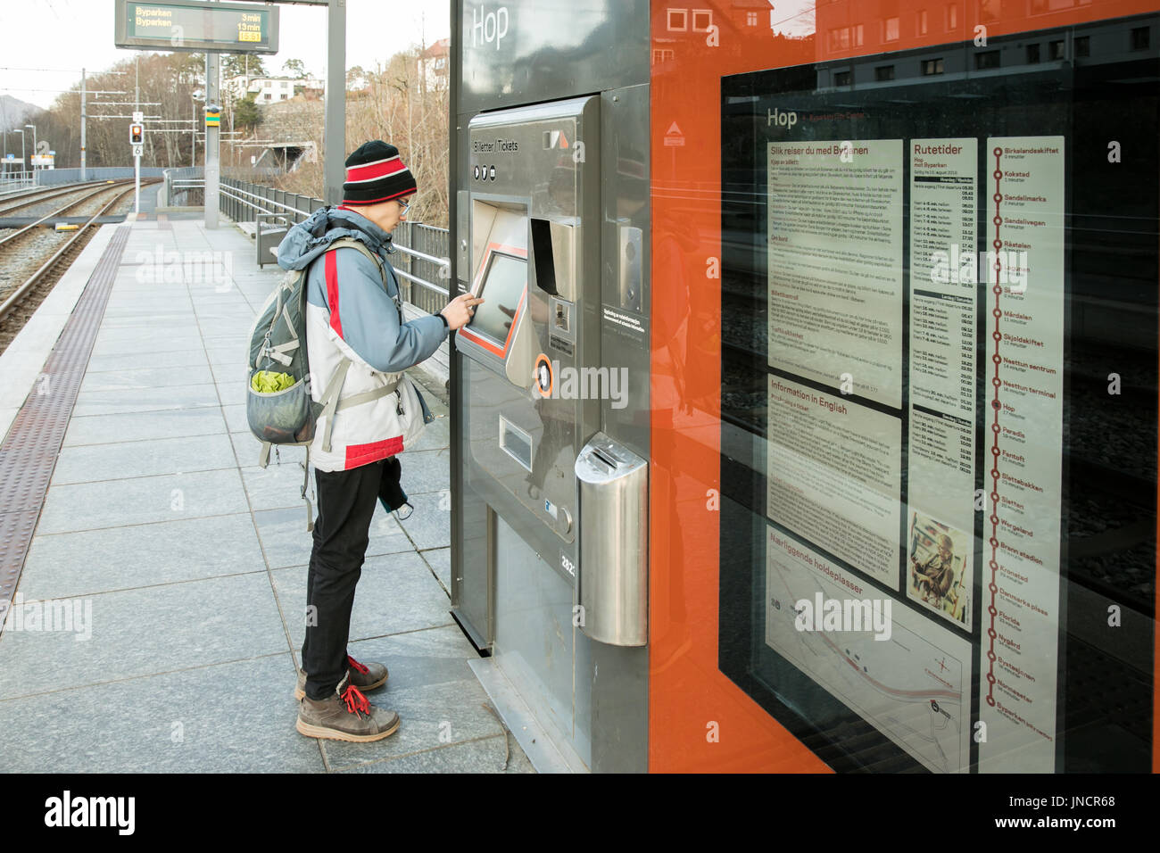 The boy buys a ticket at the color ticket booth and information point ...