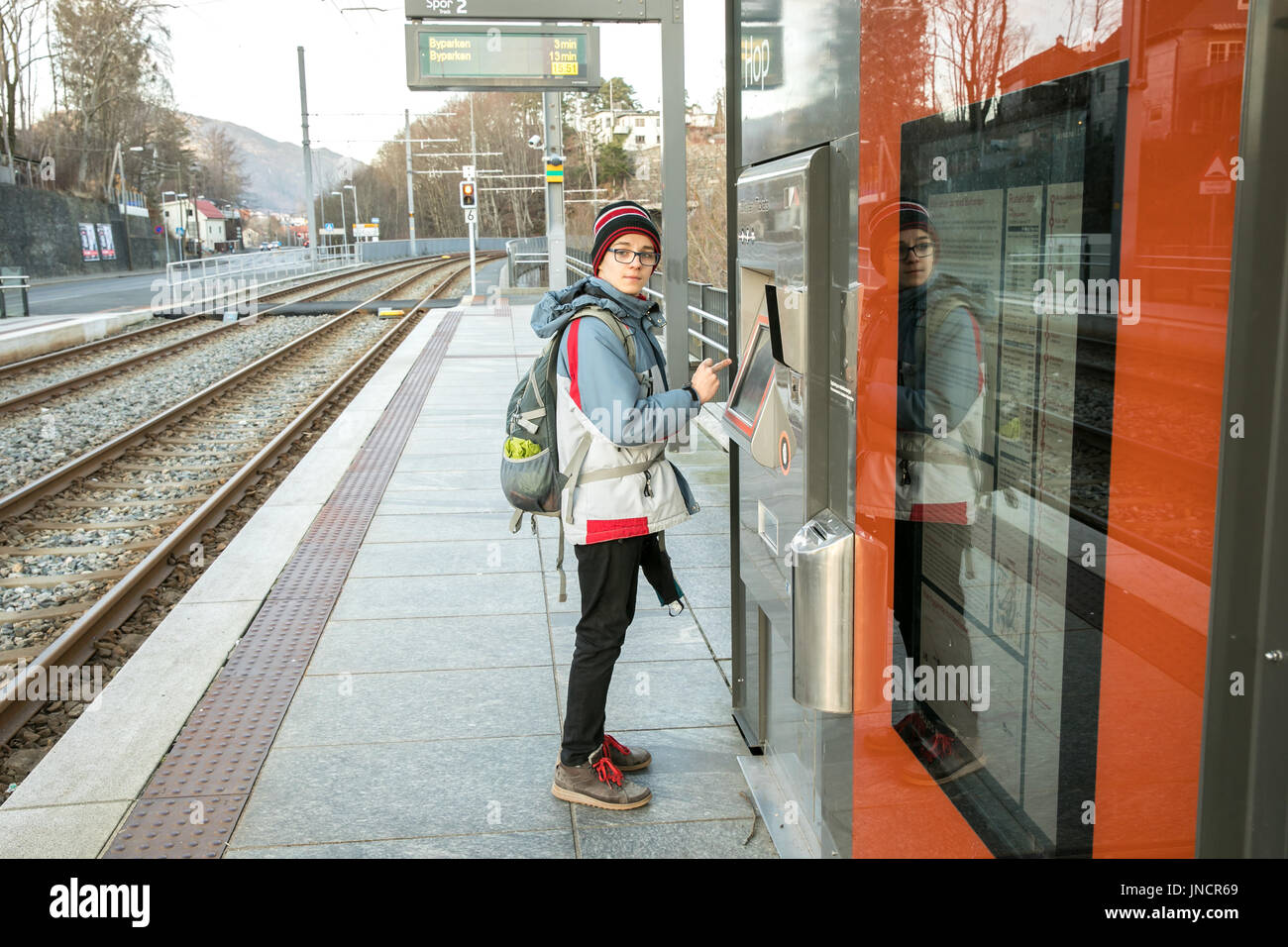 The boy buys a ticket at the color ticket booth and information point ...
