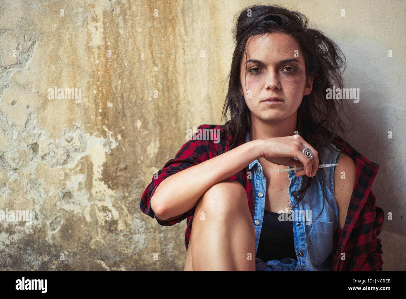 Dependence on drug heroin young woman after having pierced with syringe ...