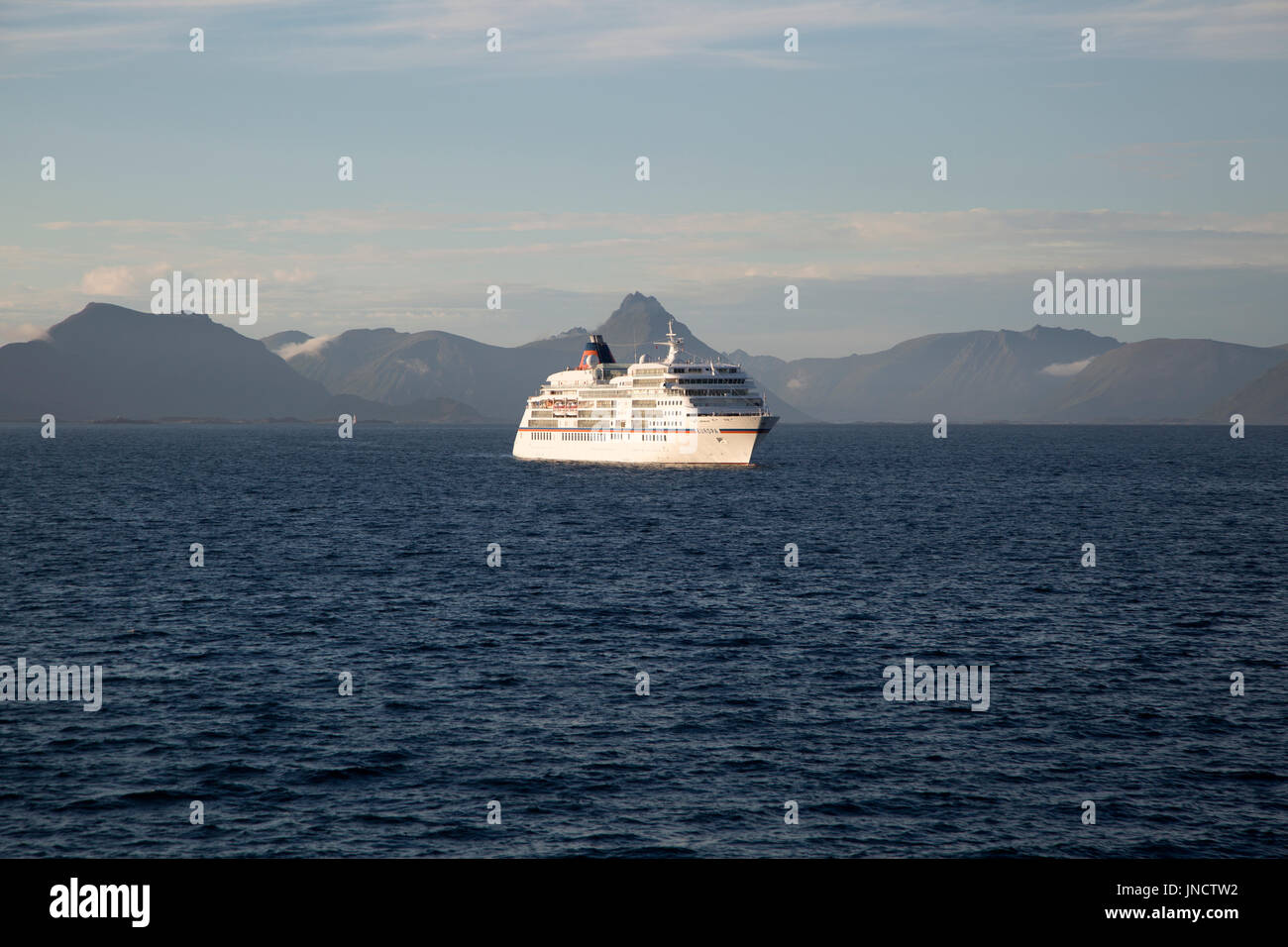 Cruise ship passing mountains of lofoten islands hi-res stock ...