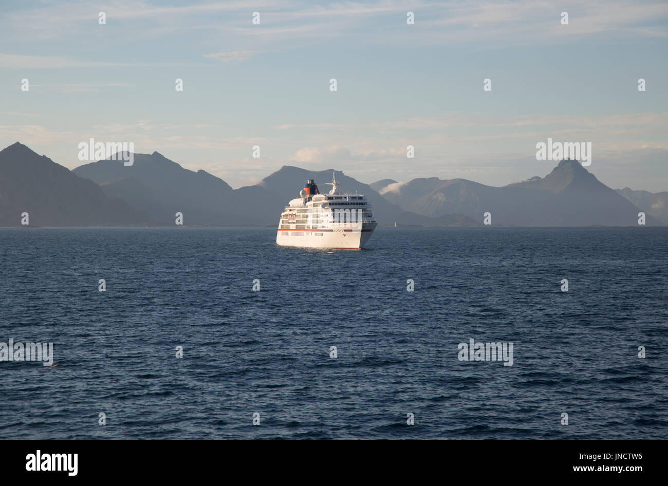 Cruise ship passing mountains of Lofoten Islands, Nordland, Norway ...