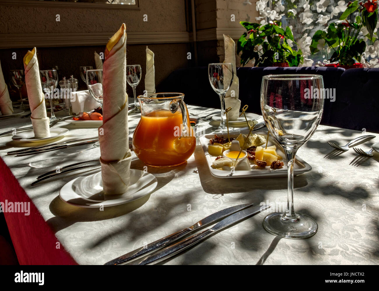 Table served with juice and appetizers in restaurant Stock Photo - Alamy