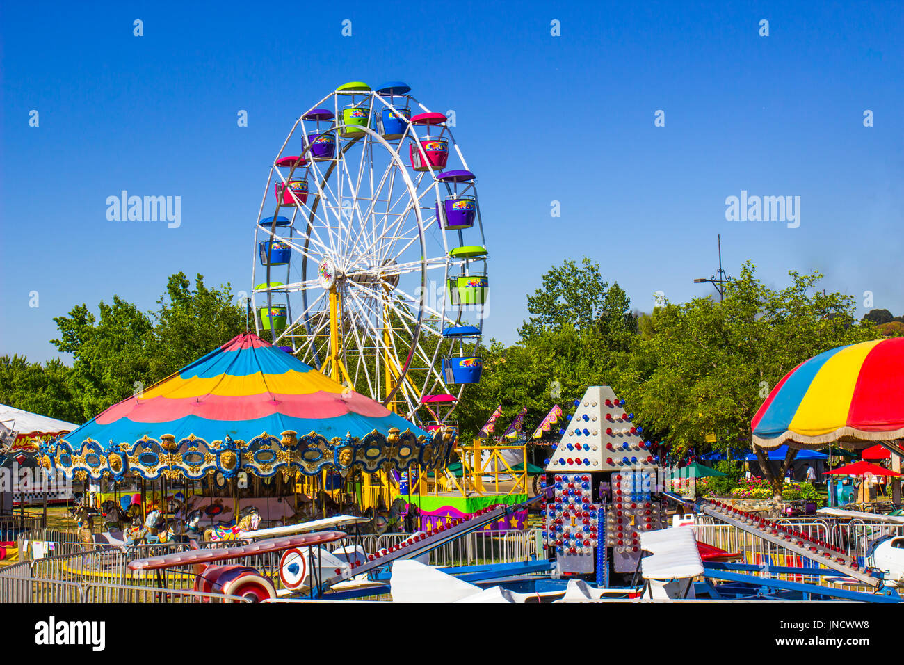 Ferris Wheel, Carousel & Other Rides At Small County Fare Stock Photo ...