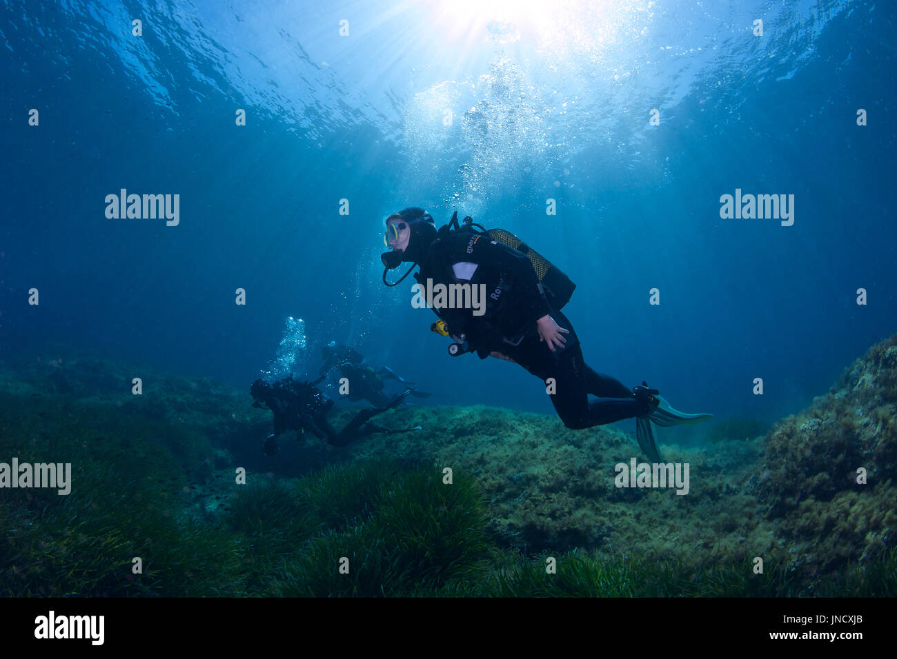 Scuba divers diving in Ses Salines Natural Park (Formentera, Balearic ...