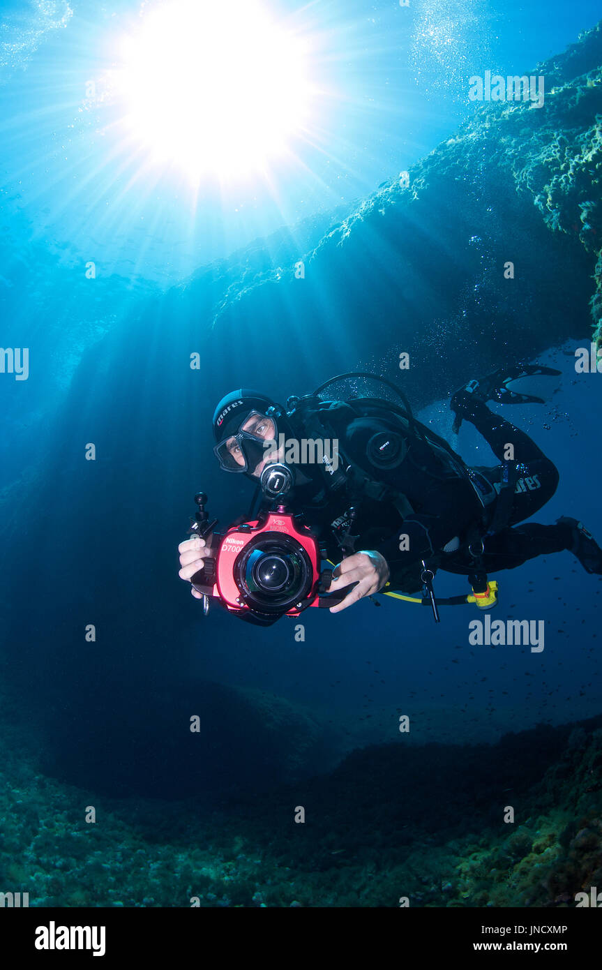 Underwater photographer scuba diving at "El Arco" dive site in Ses ...