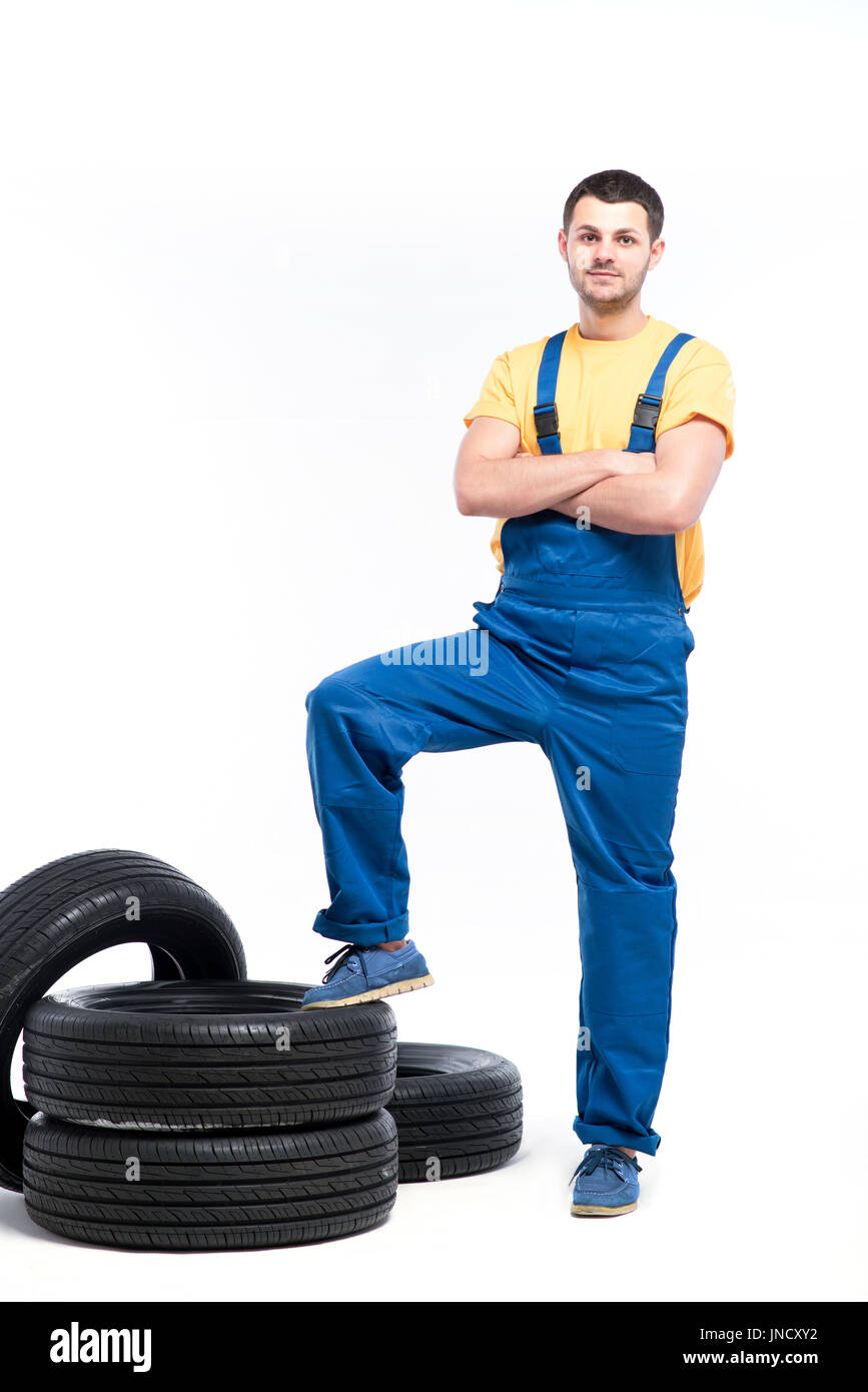 Tire serviceman isolated on white background, repairman with tyres ...