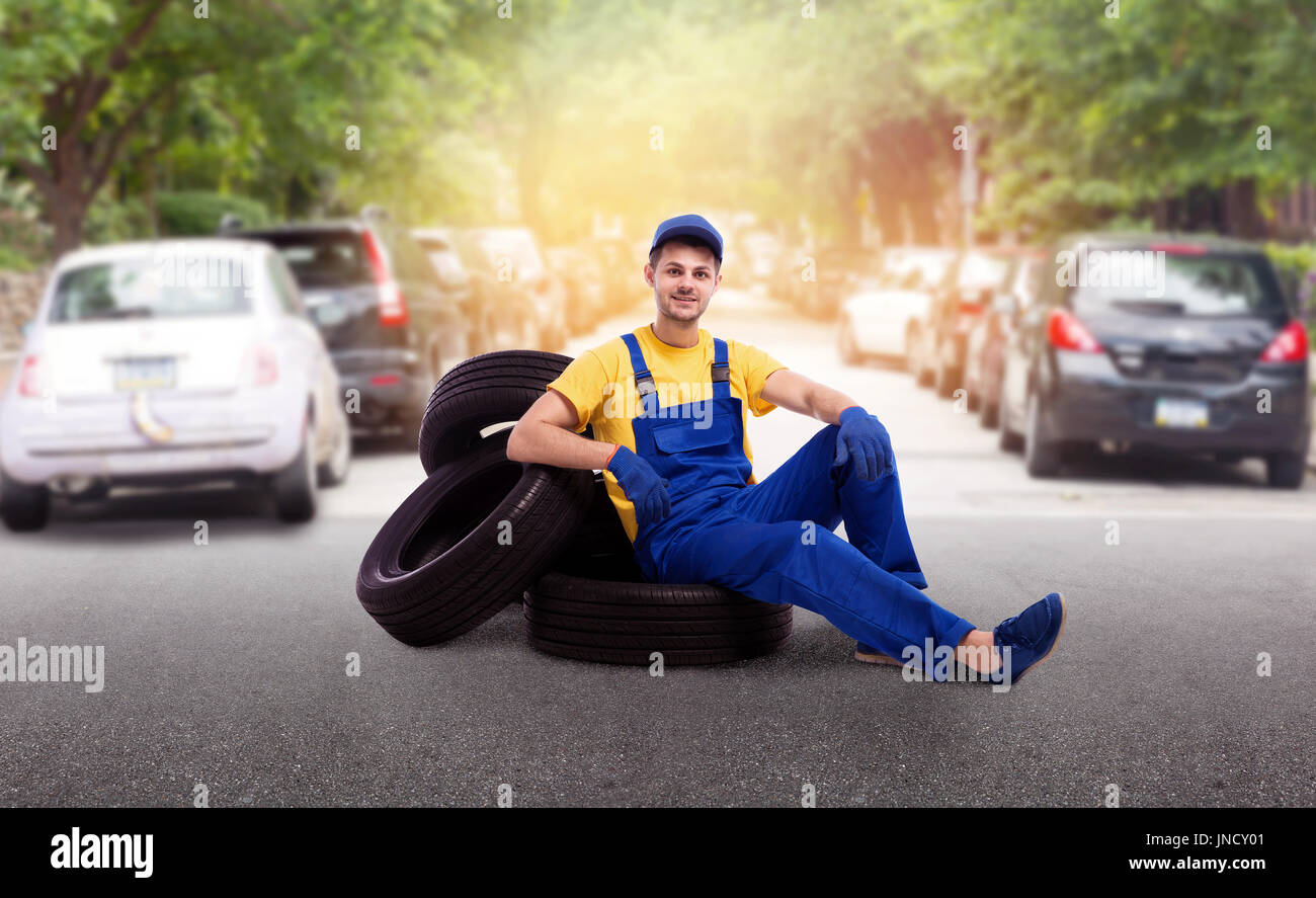 Man sitting in car tyre hi-res stock photography and images - Alamy