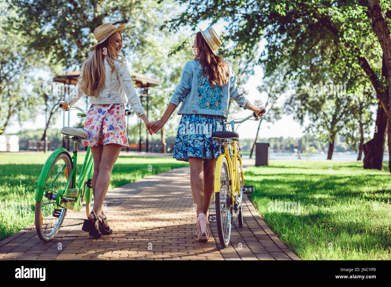 Two women holding hands hi-res stock photography and images - Alamy