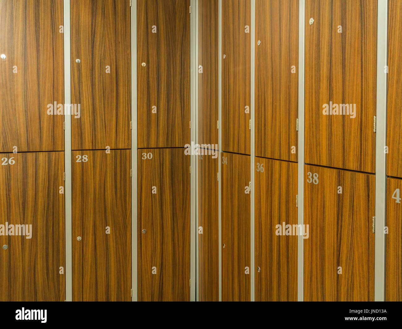The row of wooden cabinets in a fitness club dressing room Stock Photo ...