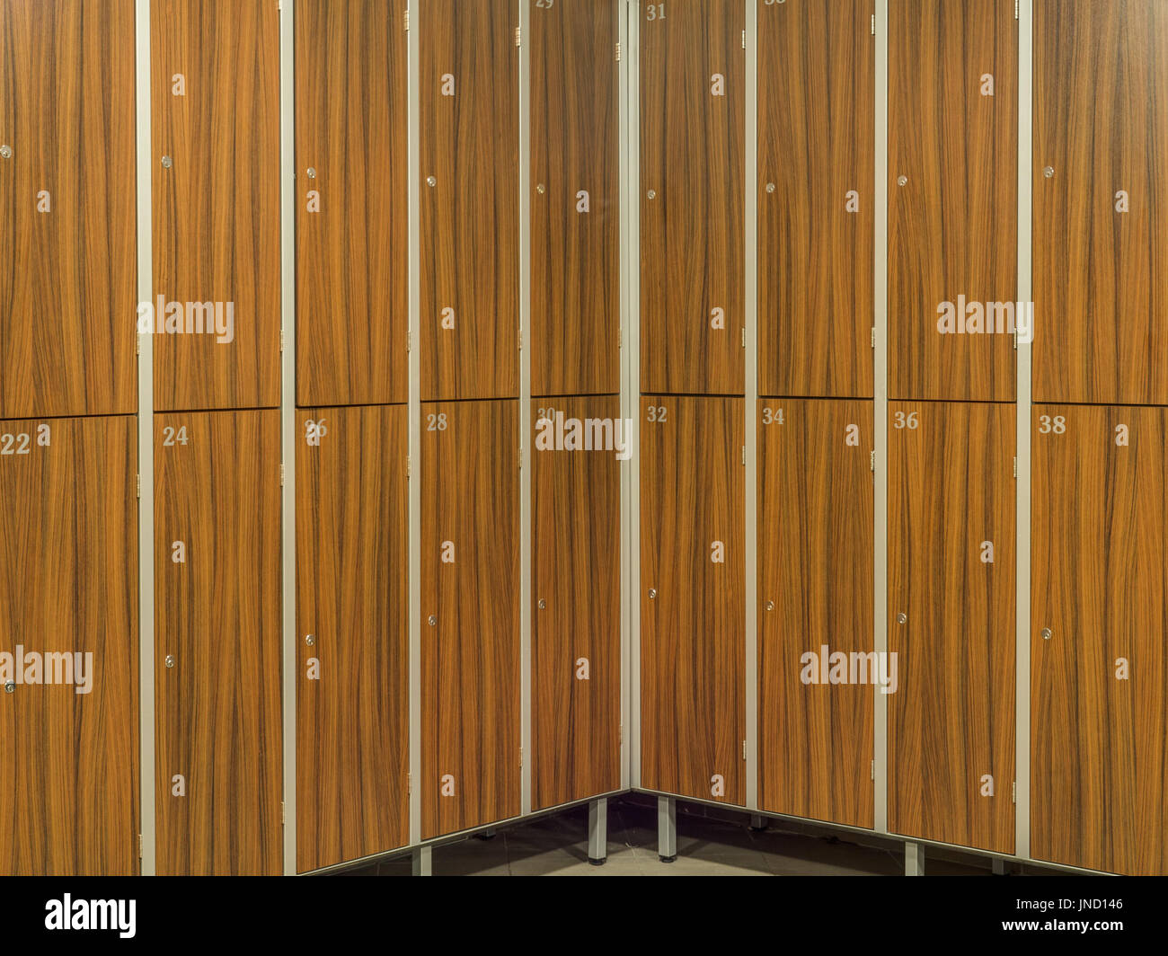 The row of wooden cabinets in a fitness club dressing room Stock Photo ...