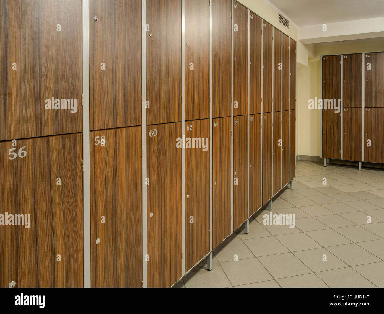 The row of wooden cabinets in a fitness club dressing room Stock Photo ...