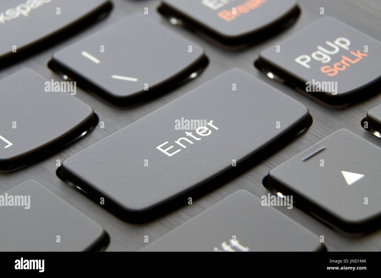 Enter button of black laptop's keyboard; Macro photo Stock Photo - Alamy