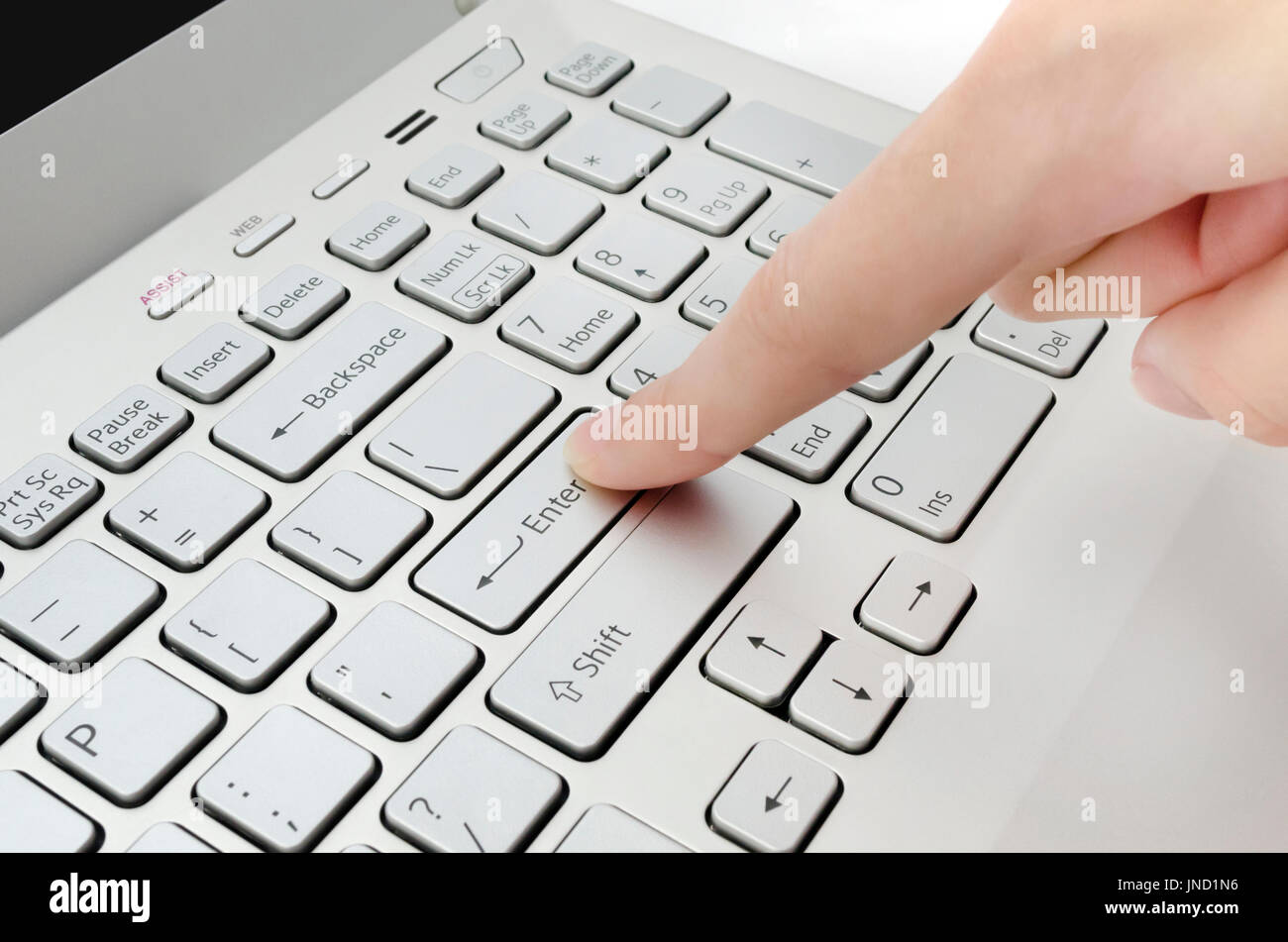 Finger pushing enter button on laptop keyboard Stock Photo - Alamy Finger pushing enter button on laptop keyboard Stock Photo - Alamy