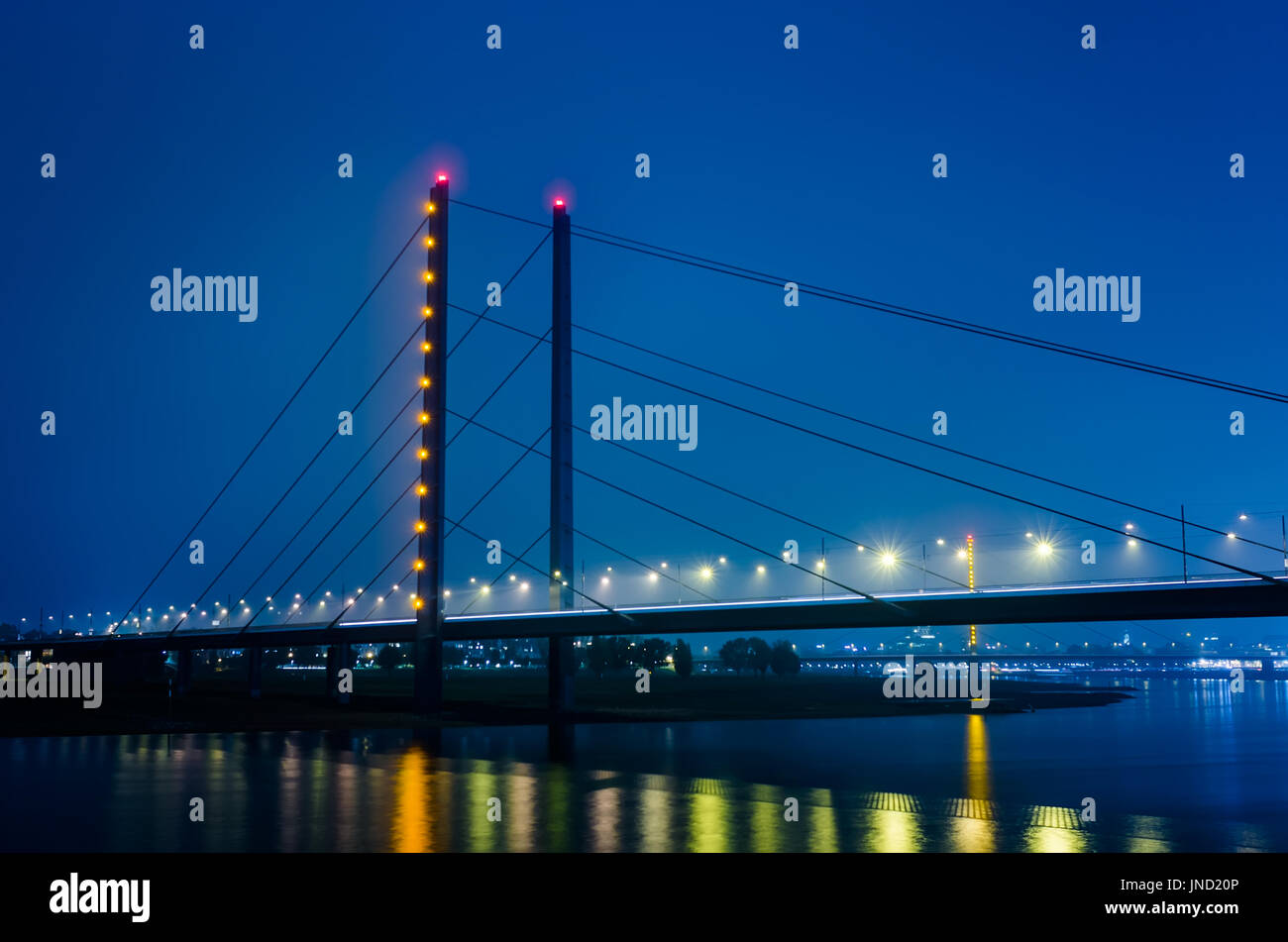 Picturesque cityscape in Dusseldorf with Rheinkniebrucke bridge over ... Picturesque cityscape in Dusseldorf with Rheinkniebrucke bridge over ...