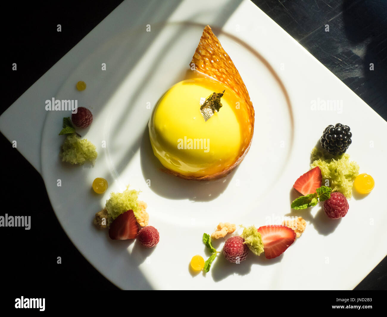 Mango parfait with passion fruit twill, and Apperol Shpritz Stock Photo ...