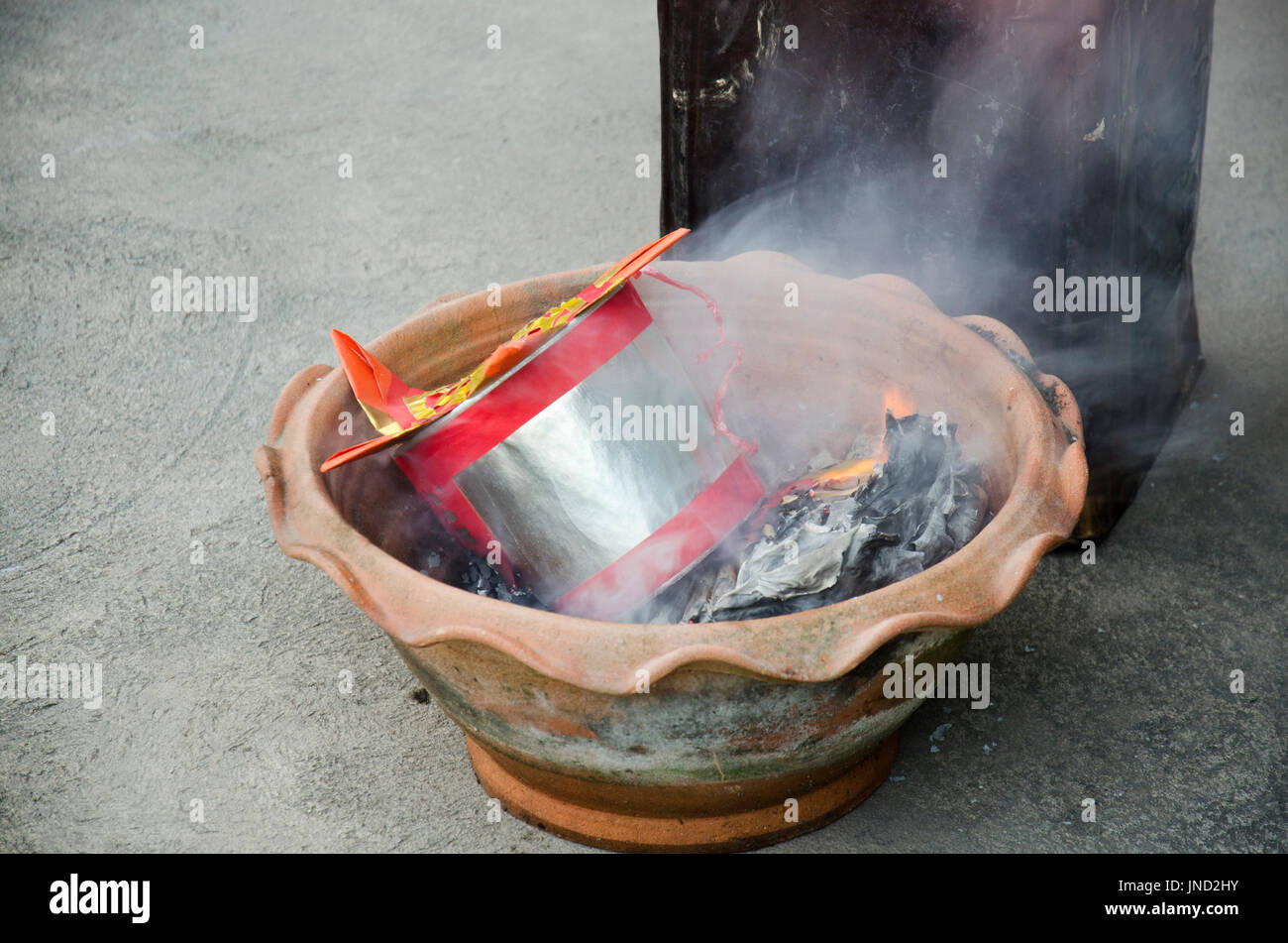 People burn joss paper gold and silver paper for worship with paper ...