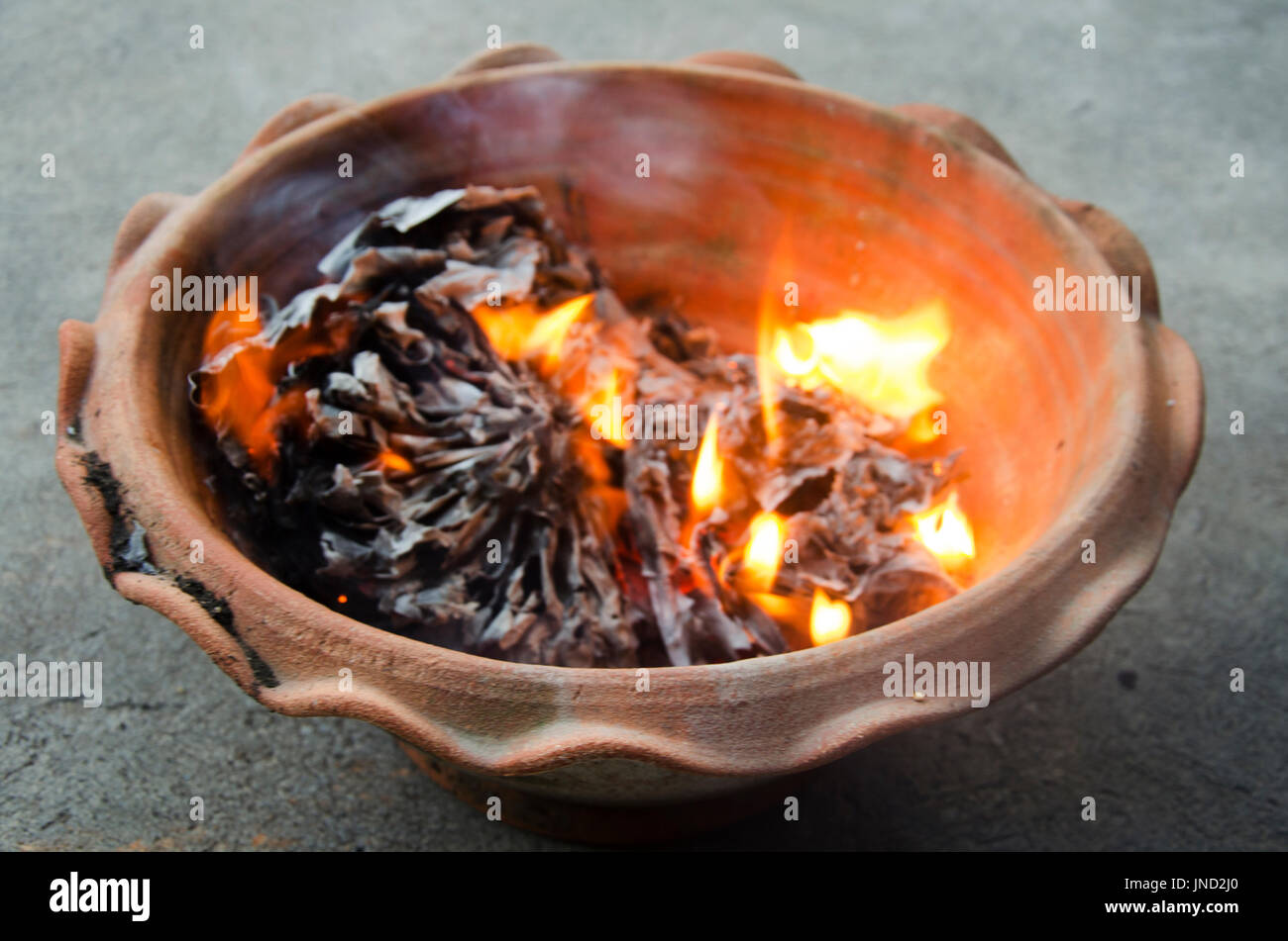 People burn joss paper gold and silver paper for worship with paper ...