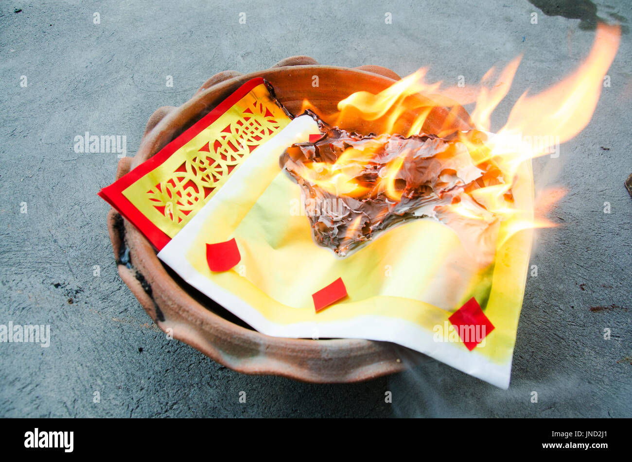 People burn joss paper gold and silver paper for worship with paper ...